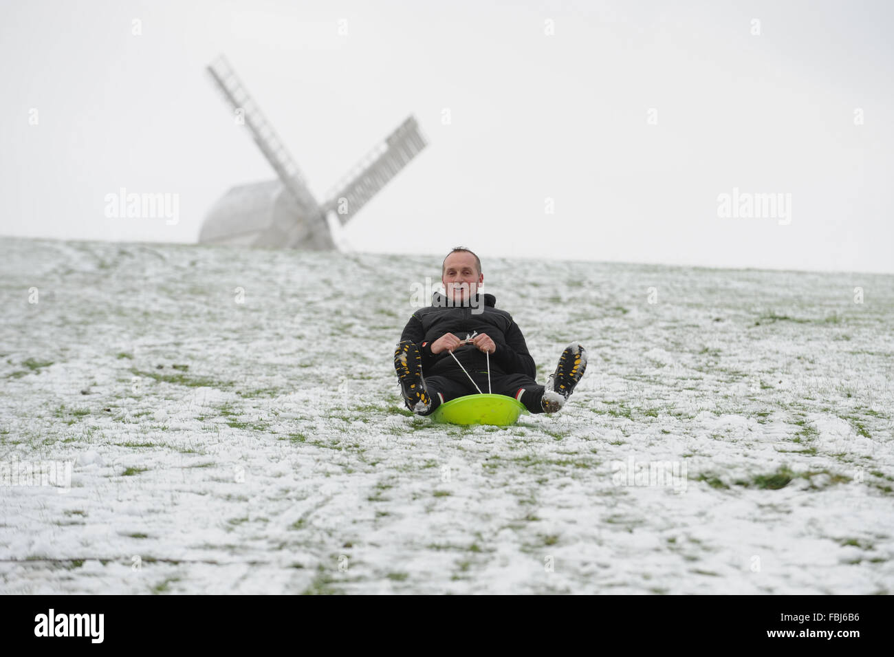 Adult man sliding down slide hi-res stock photography and images - Alamy