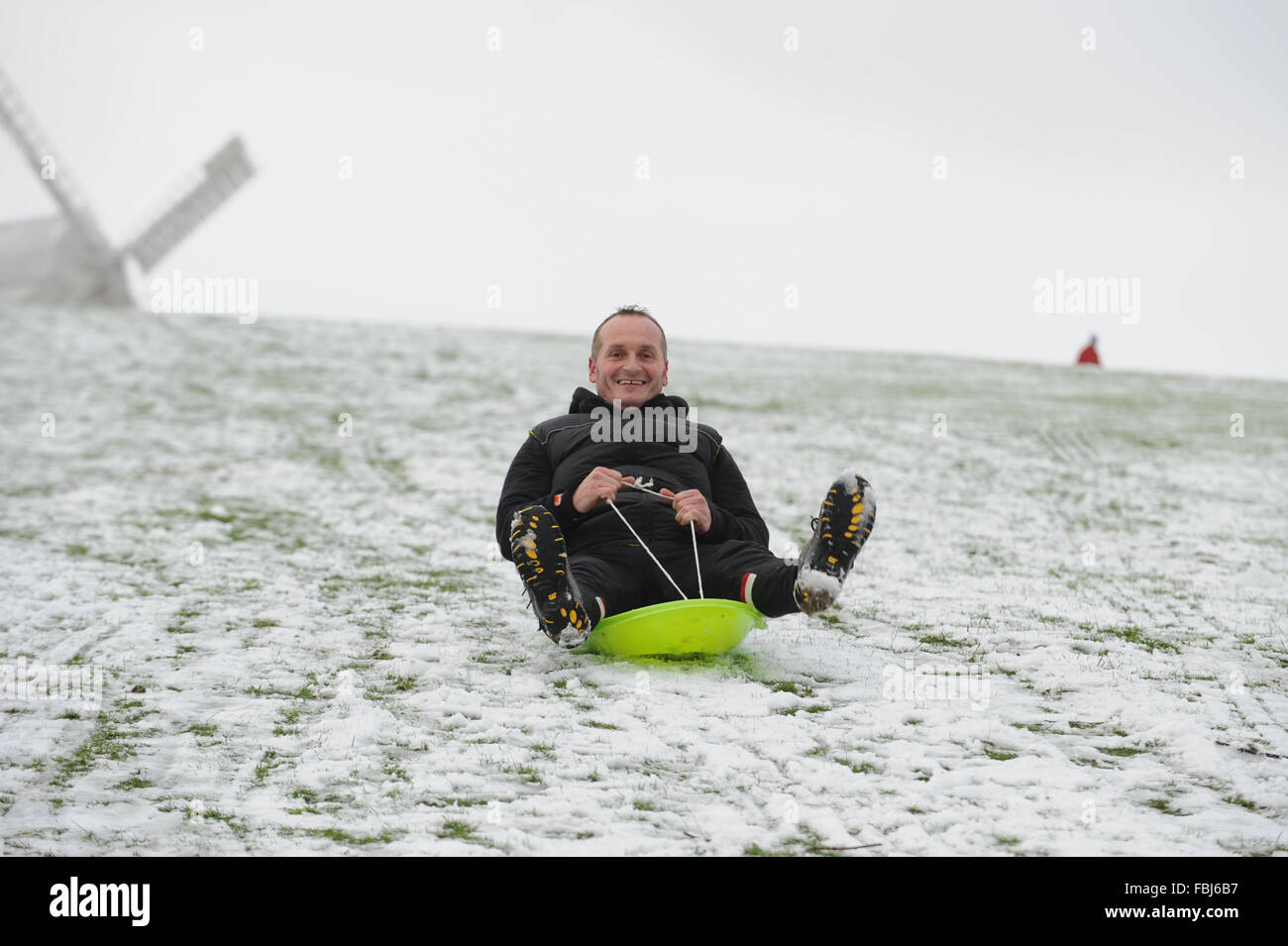 Adult man sliding down slide hi-res stock photography and images - Alamy