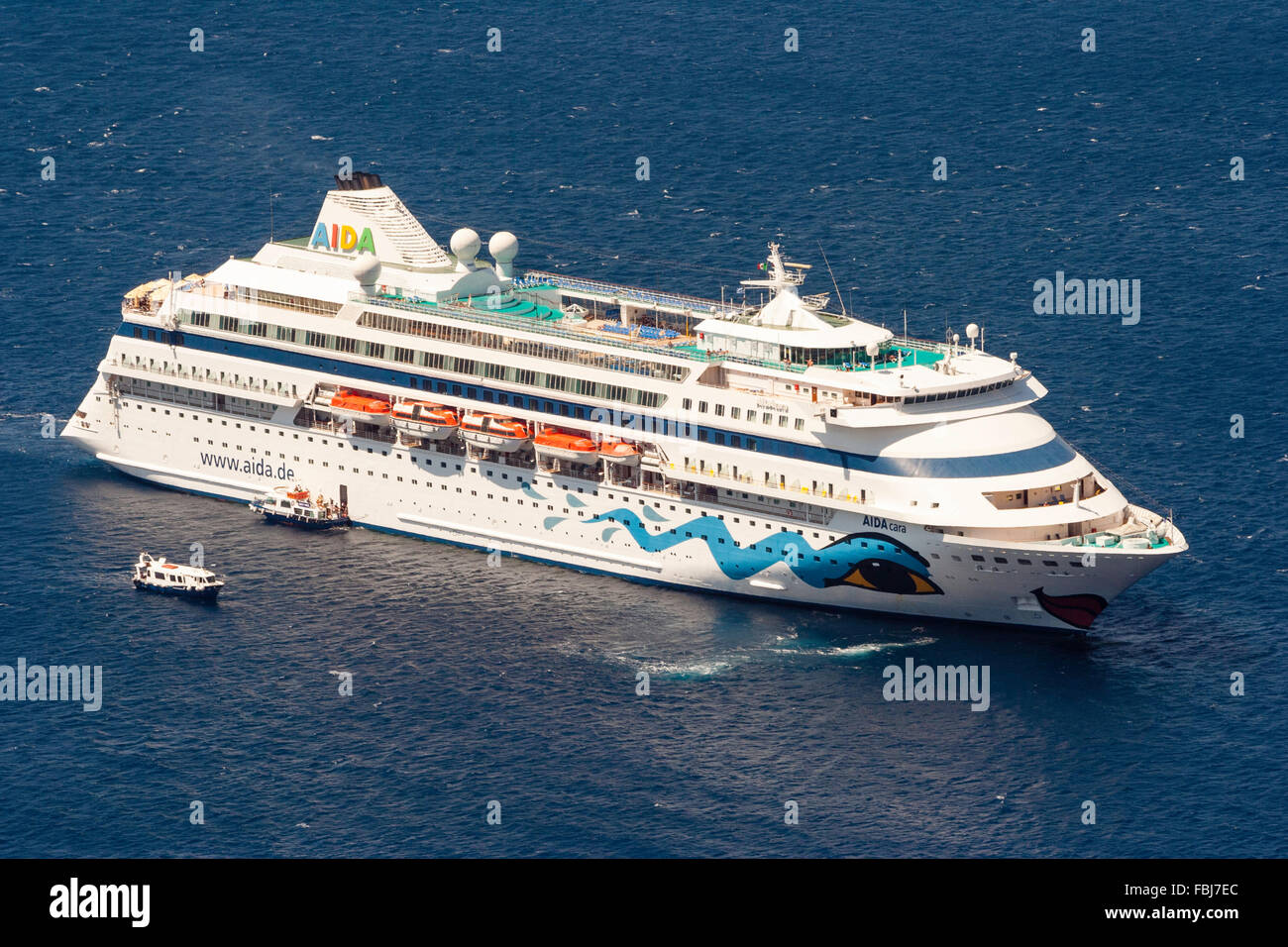 Santorini in Aegean Sea. Ocean-going luxury cruise ship, Aida Cara ...