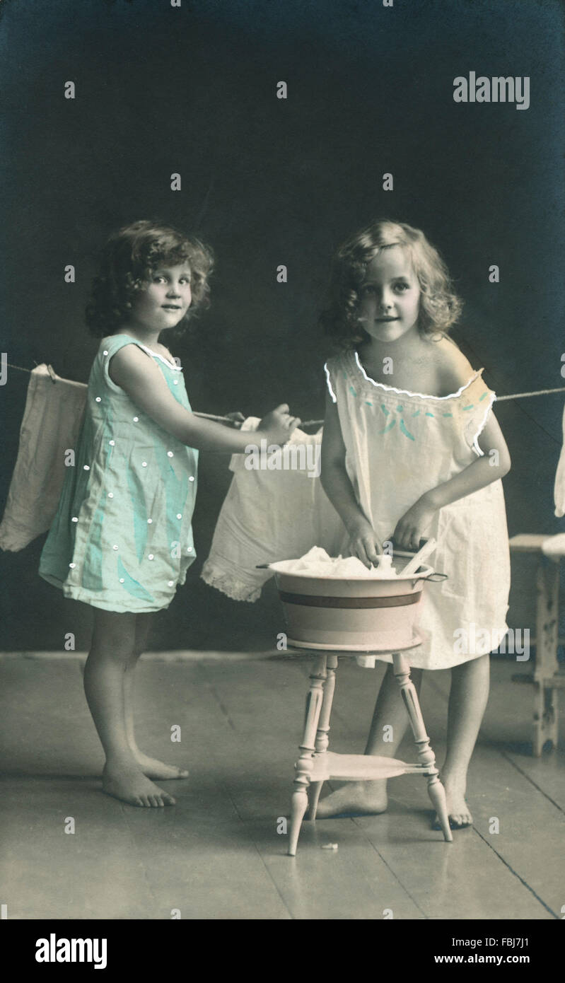Postcard, historical, two girls, play, household, washing day Stock ...