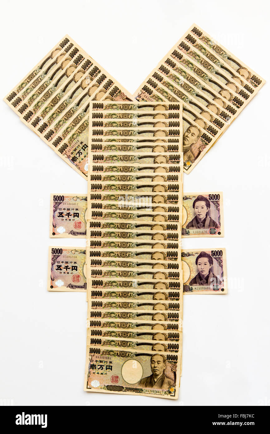 Money, currency. Japanese banknotes, various amounts, laid out on plain ...