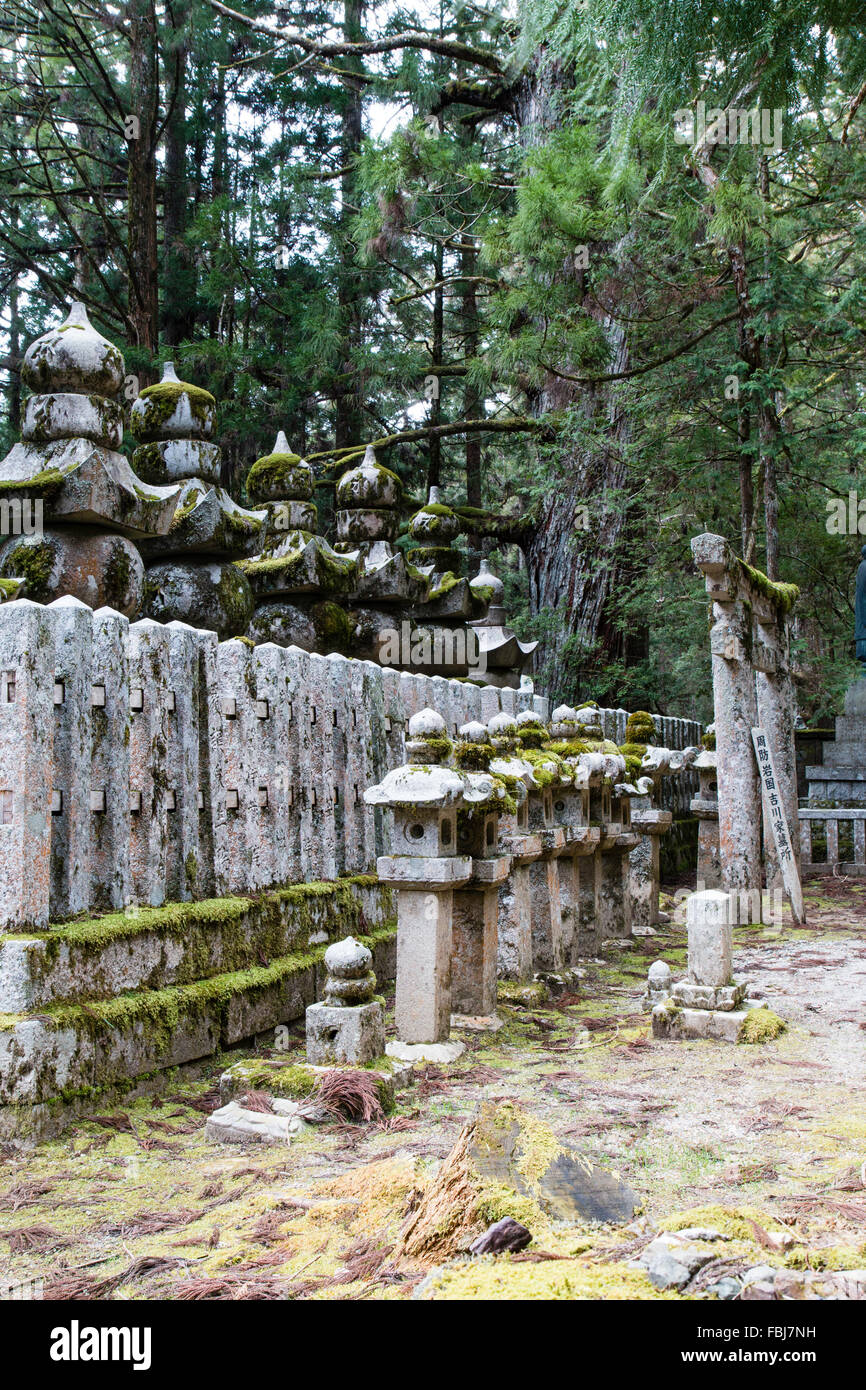 Japan, Koyasan, Okunoin forest cemetery. Row of traditional Toro stone ...
