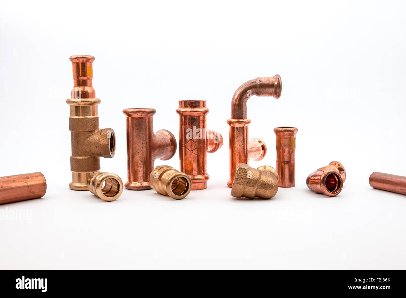 mapress copper various pieces on an white background Stock Photo - Alamy