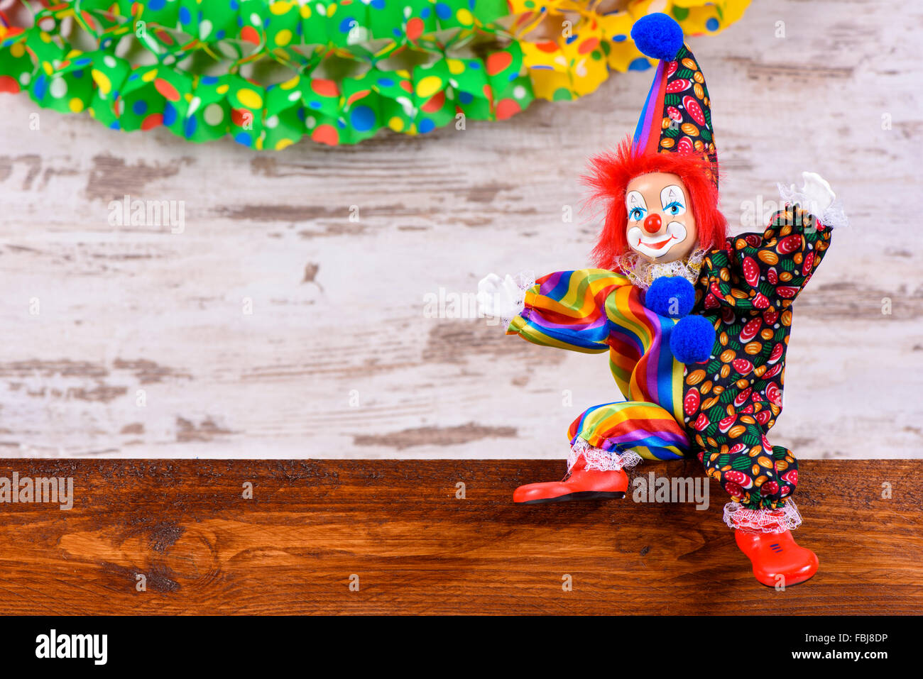 clown with paper streamer at carnival party Stock Photo - Alamy