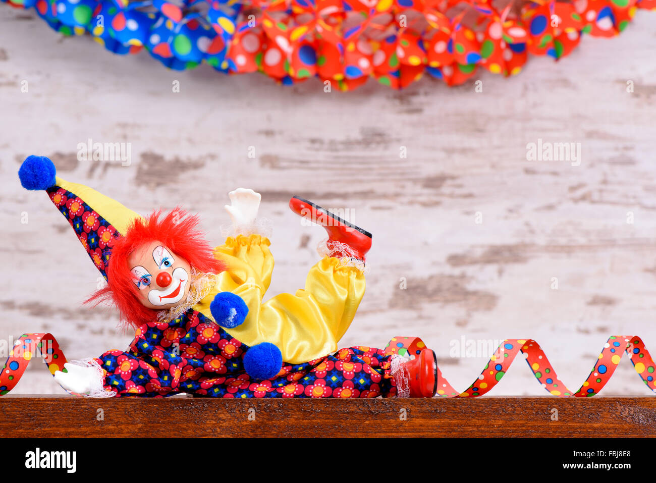 clown with paper streamer at carnival party Stock Photo - Alamy