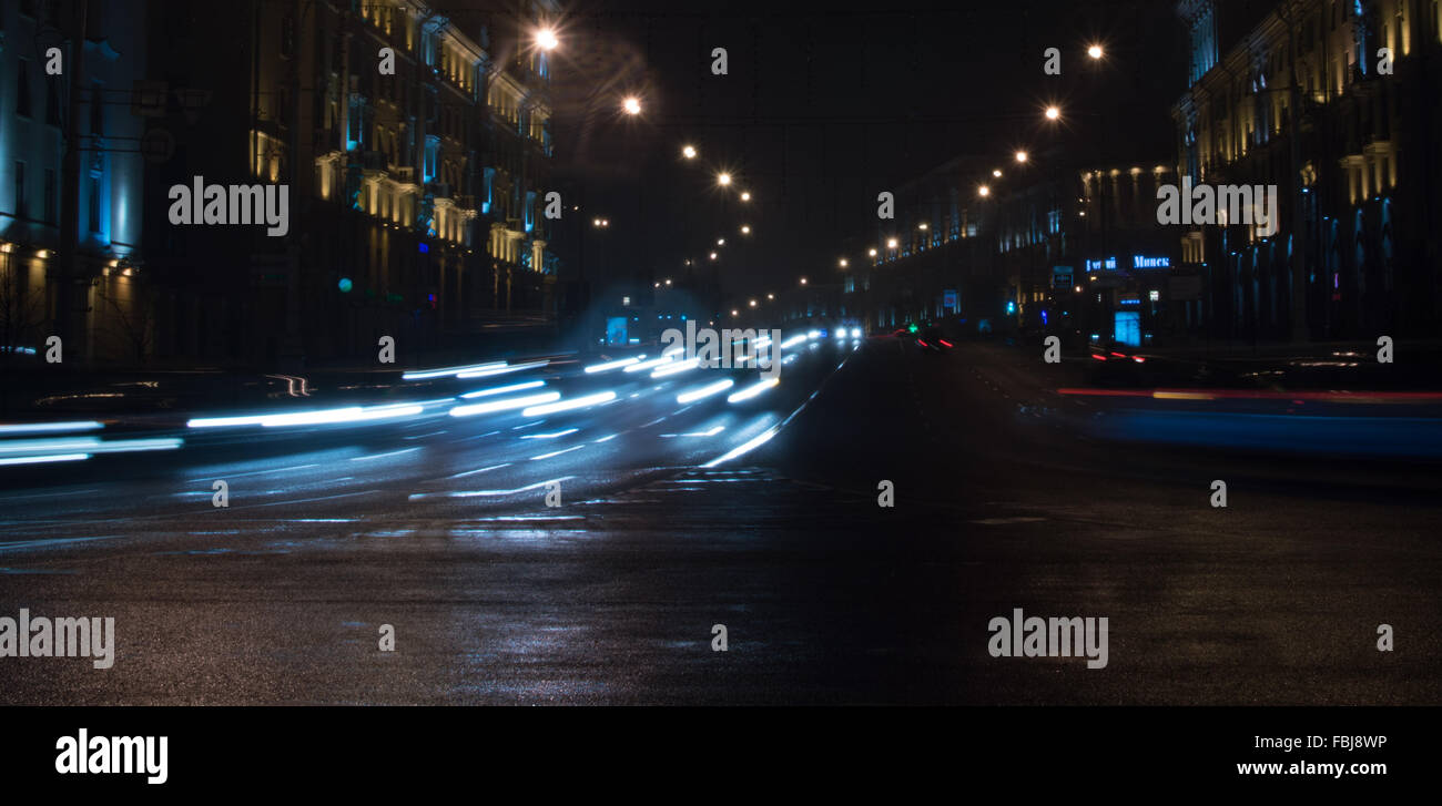 Cars, lights and city life in nighttime Stock Photo - Alamy