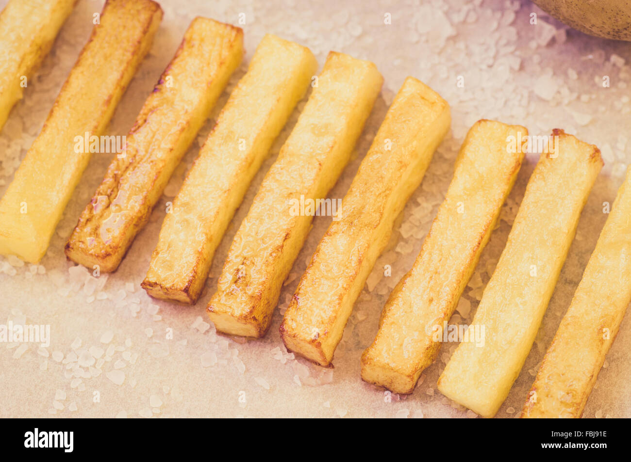 French fries strips closeup of salt in oil Stock Photo - Alamy