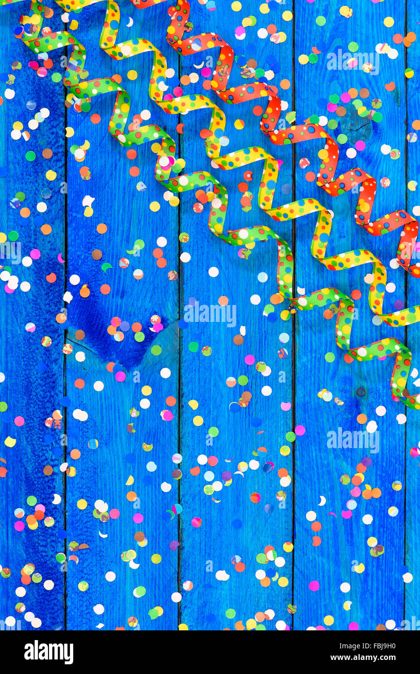 colorful paper streamer at carnival party over blue background Stock ...