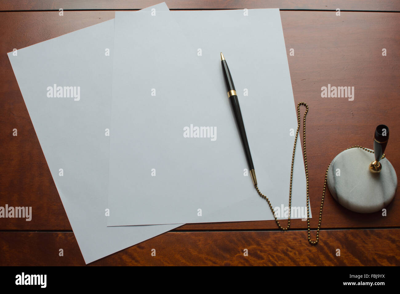 Paper and pen ready for work Stock Photo - Alamy