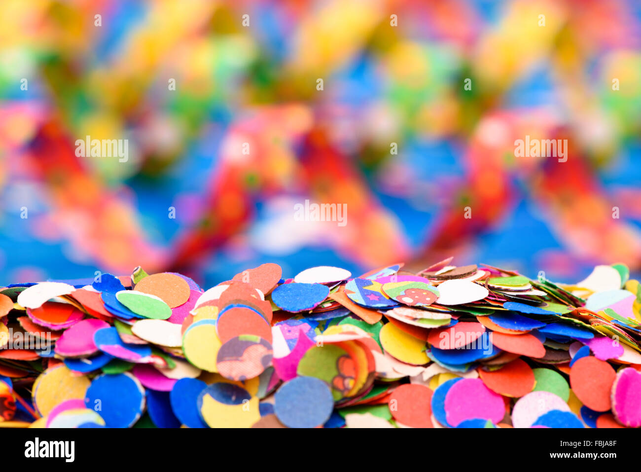 colorful paper streamer at carnival party over blue background Stock ...