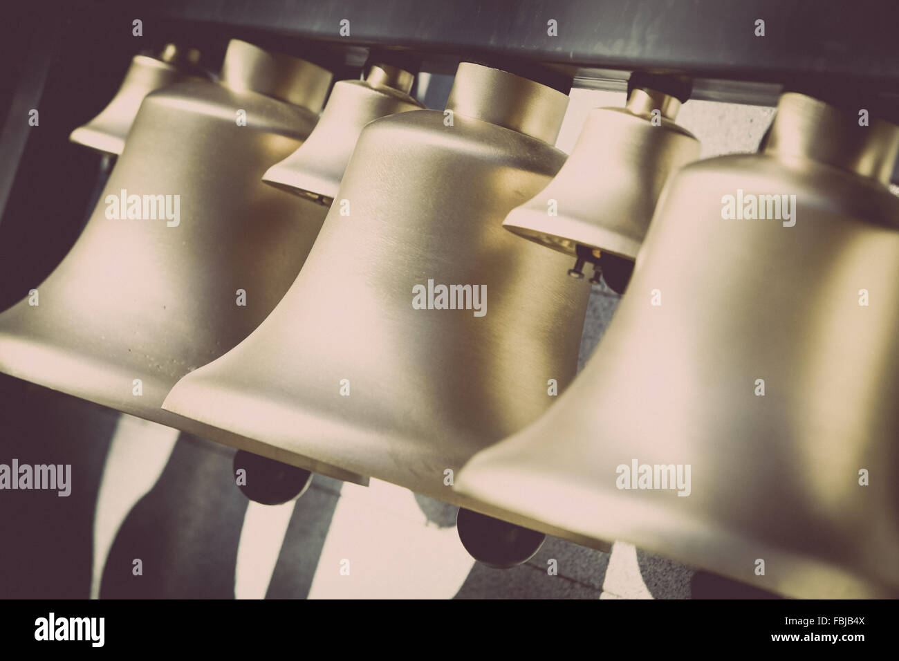 Color image of some various sized bells in a row Stock Photo - Alamy