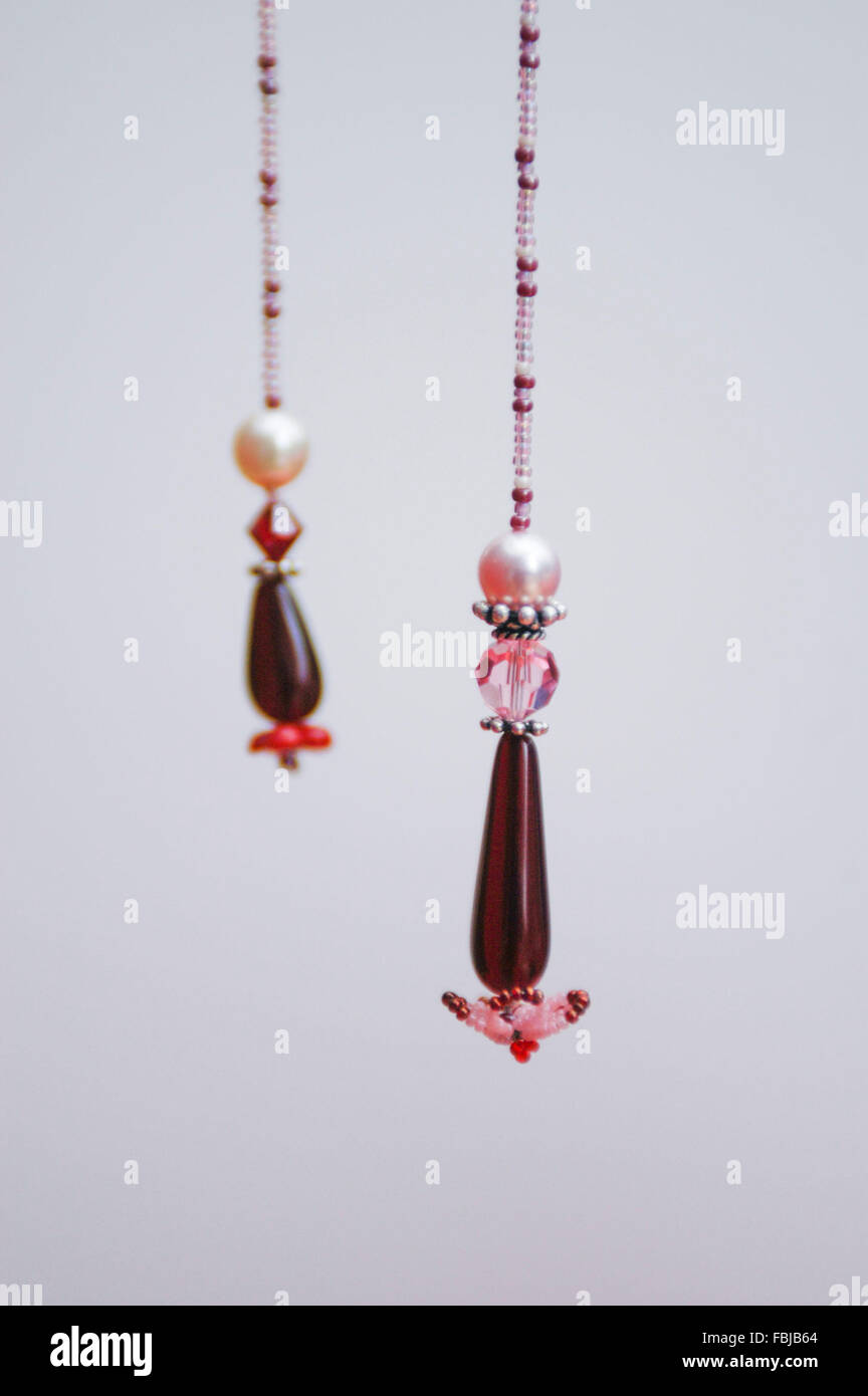 Bookmarks made of pearls and stones in front of white Stock Photo - Alamy
