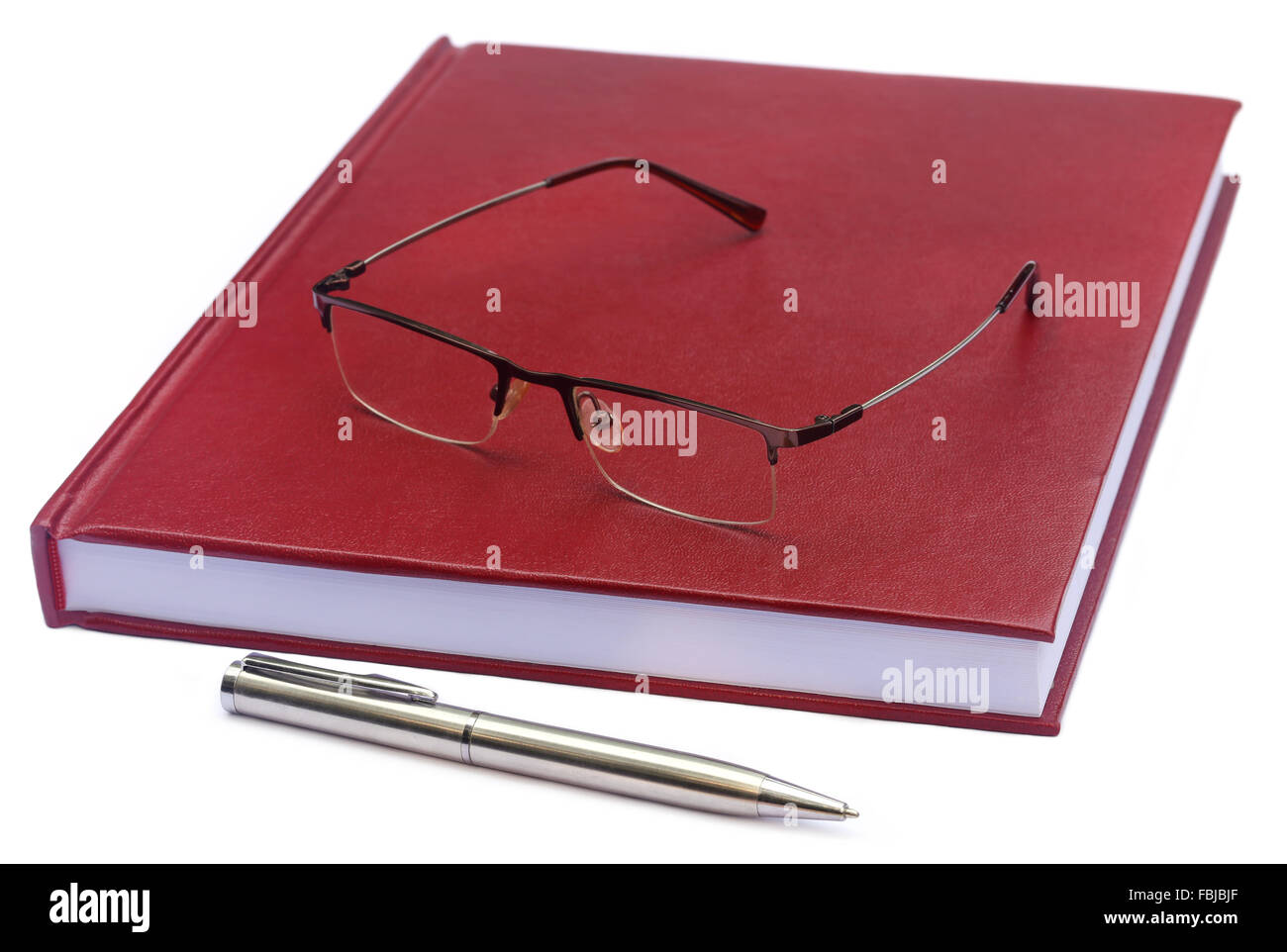 Maroon colored thesis paper with spectacles over white background Stock ...