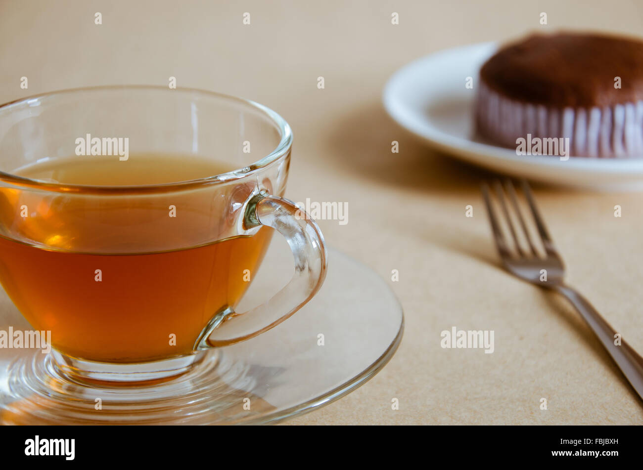 Glass Cup of Tea and Chocolate Cake for Tea Break Stock Photo - Alamy