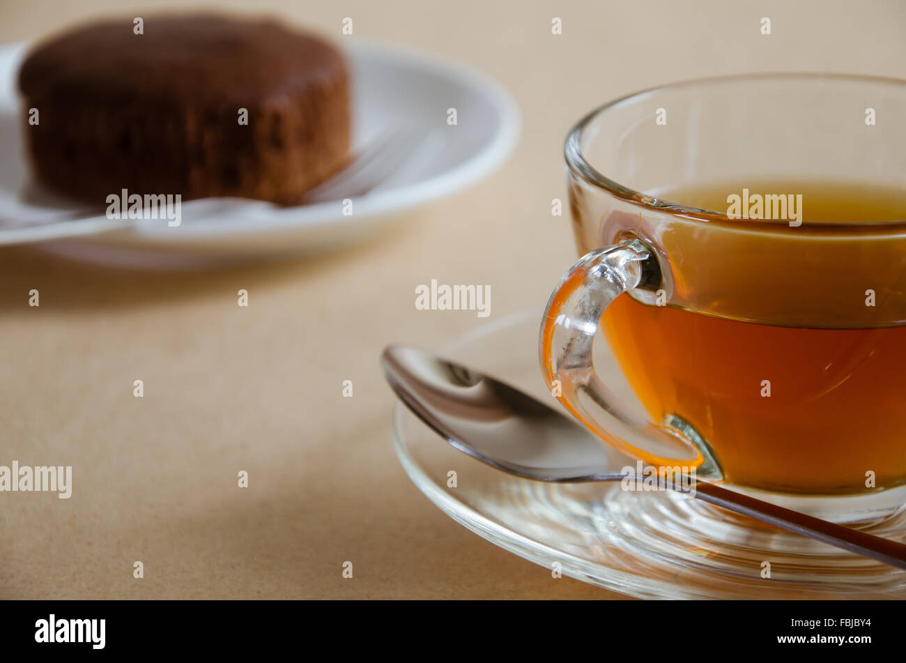 Glass Cup of Tea and Chocolate Cake for Tea Break Stock Photo - Alamy