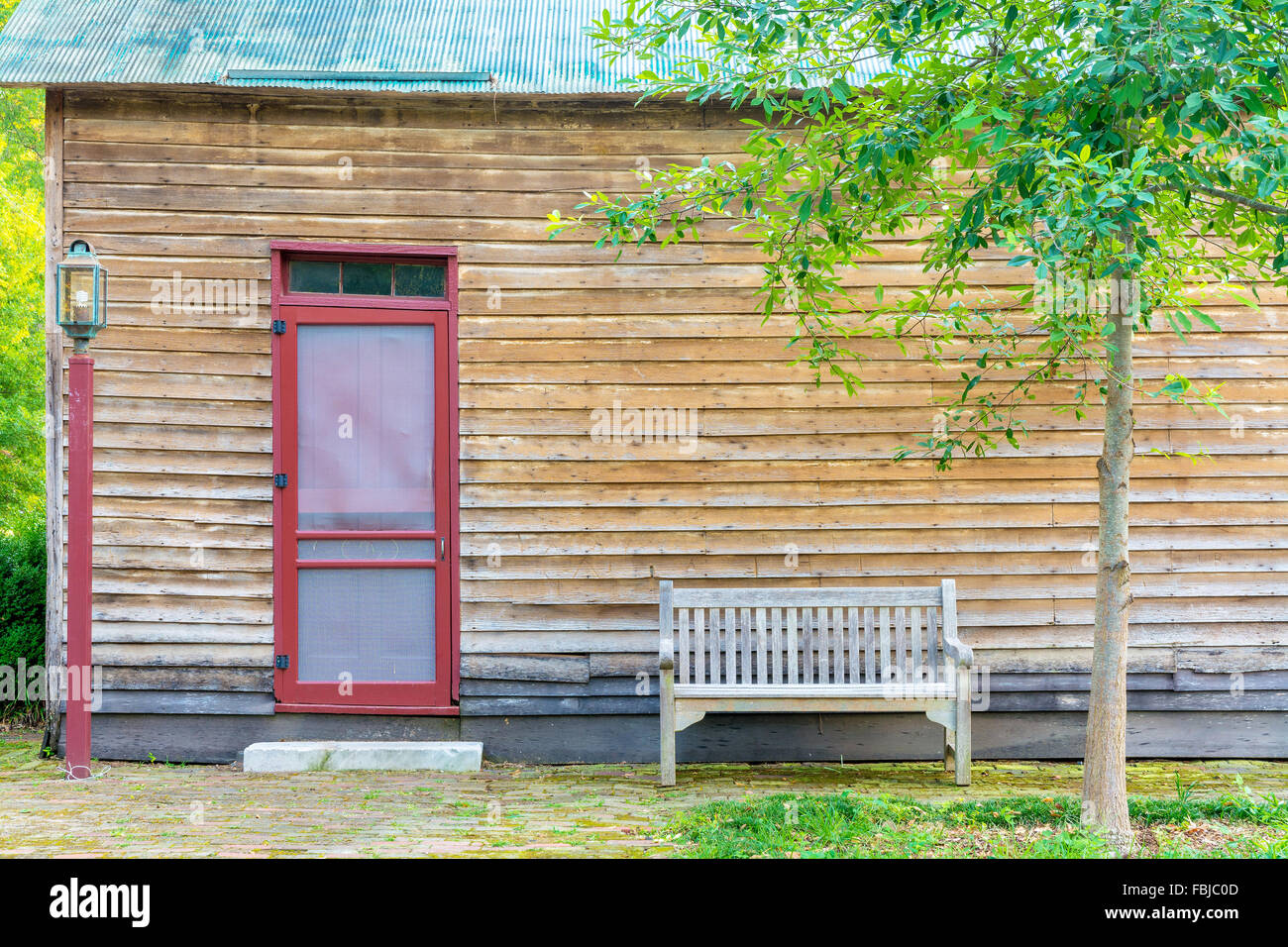 Old wood building and lamp with tree Stock Photo - Alamy
