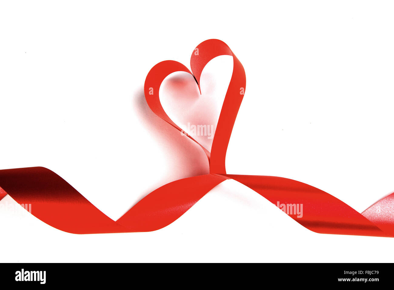 Heart from red ribbon isolated on white background Stock Photo - Alamy