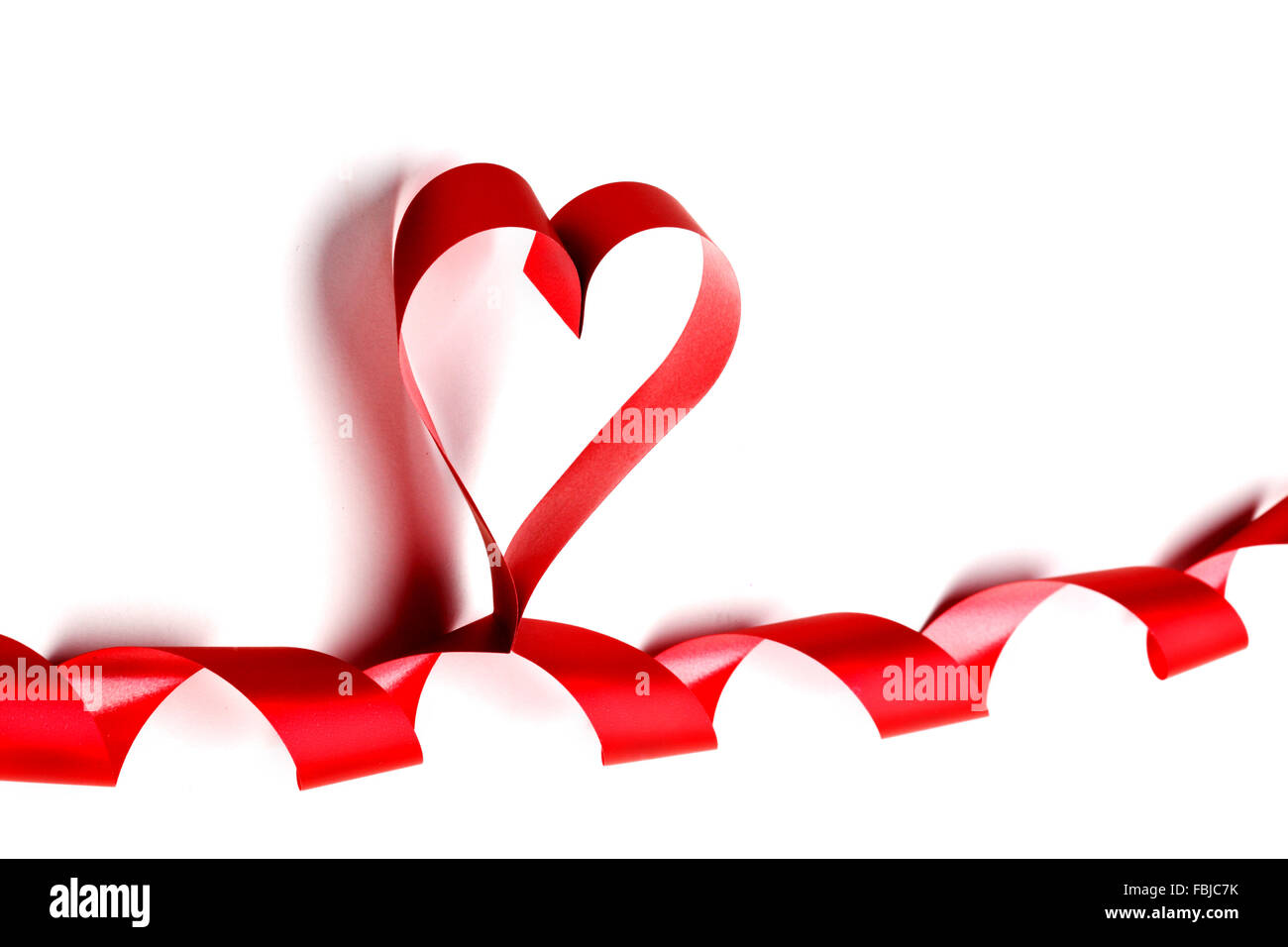 Heart shaped red ribbon isolated on white background Stock Photo - Alamy