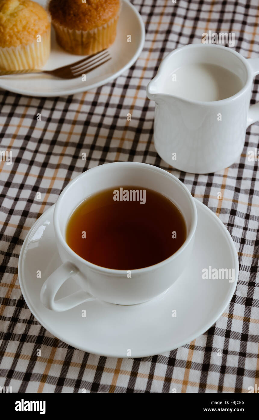 Tea and Milk with Butter Cup Cake for Tea Break Stock Photo - Alamy