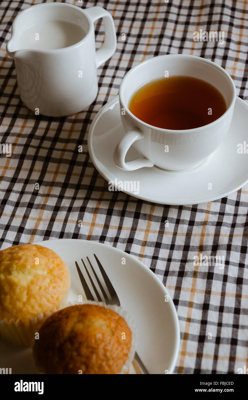 Tea and Milk with Butter Cup Cake for Tea Break Stock Photo - Alamy
