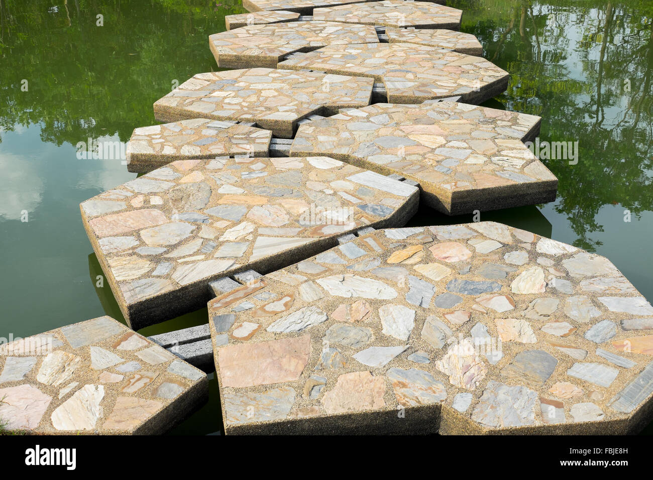 Beautiful stone bridge across the lake in Sirikit park, Bangkok ...