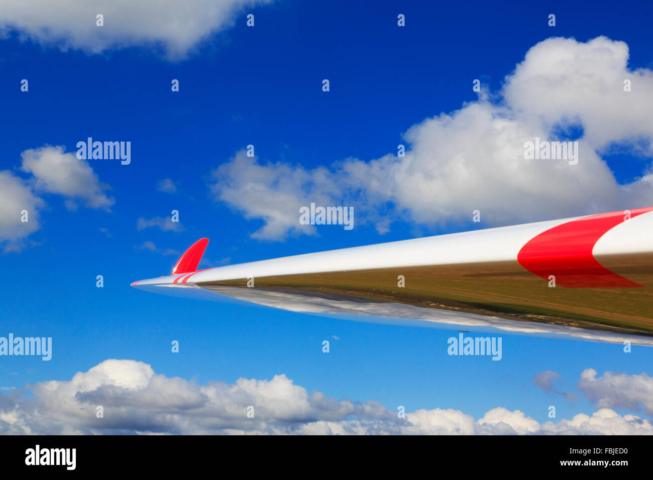 Duo Discus glider wing tip against blue, cloudy sky Stock Photo - Alamy