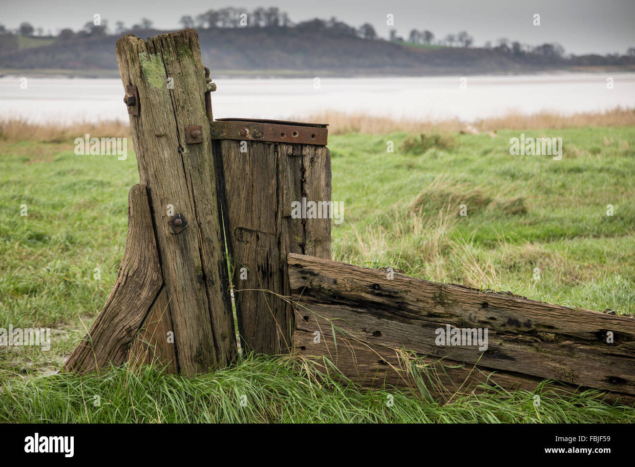 The rudder of a decaying wooden barge at the Purton Hulks ships ...
