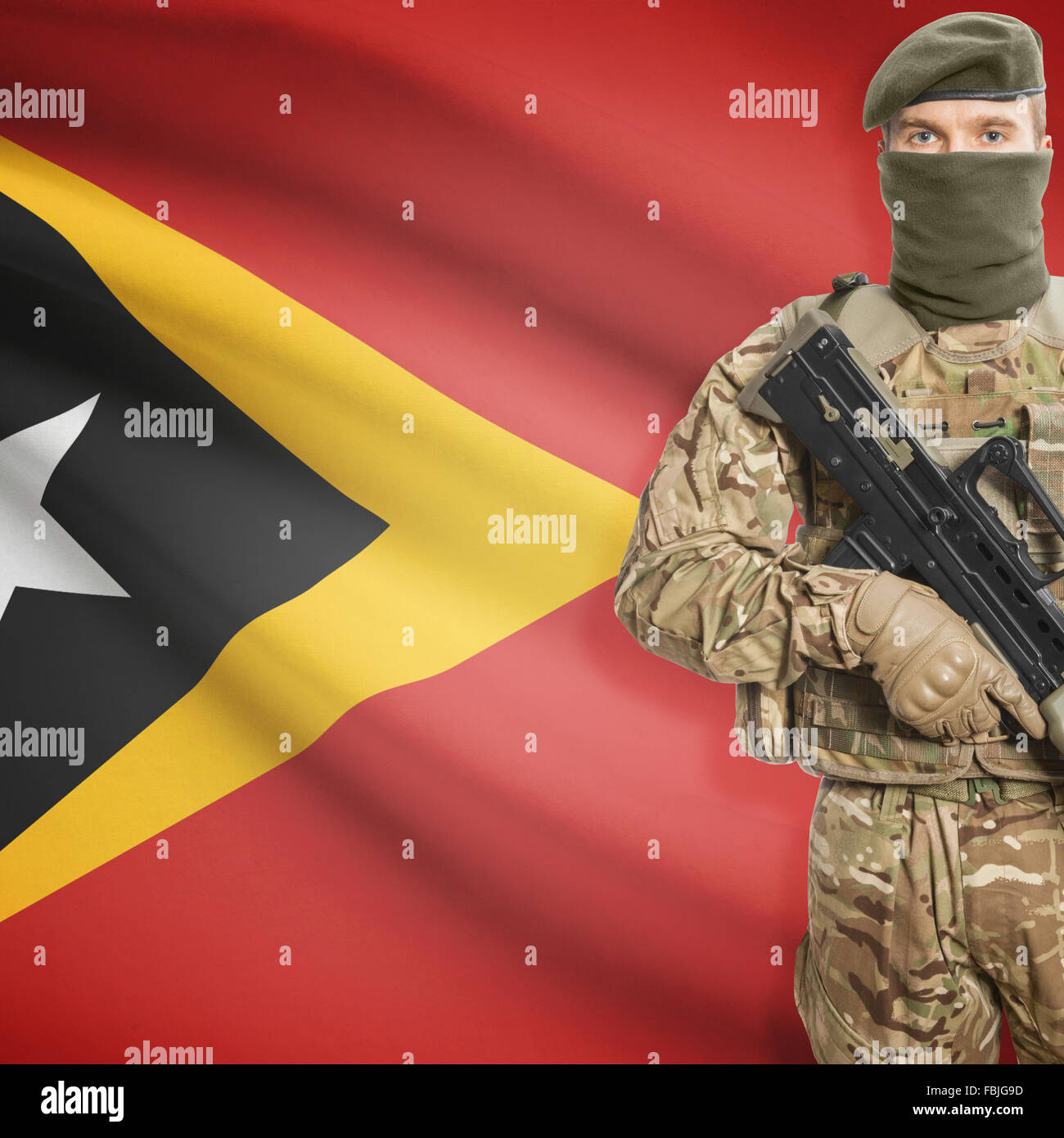 Soldier with machine gun and national flag on background series - East ...