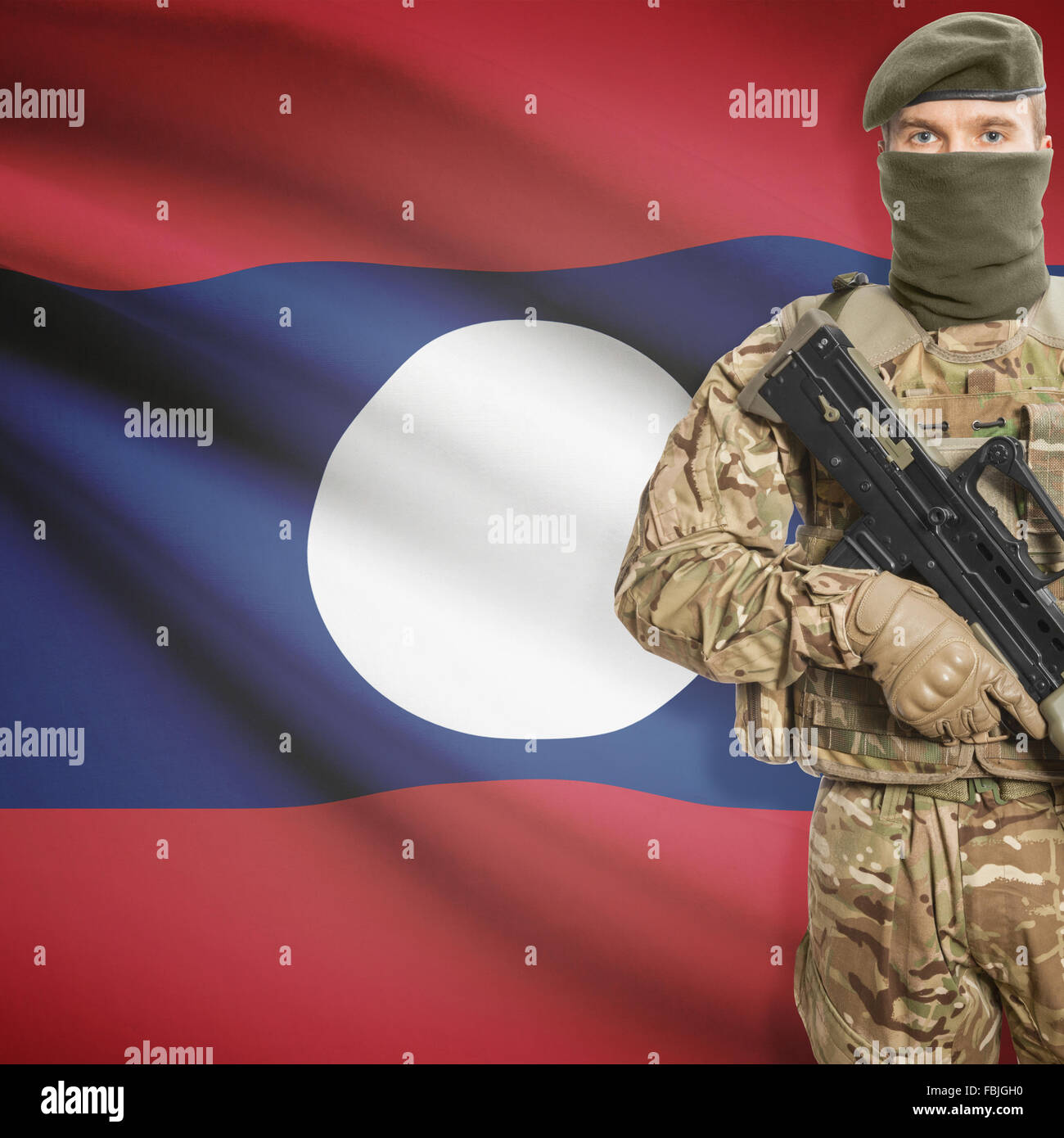 Soldier with machine gun and national flag on background series - Laos ...