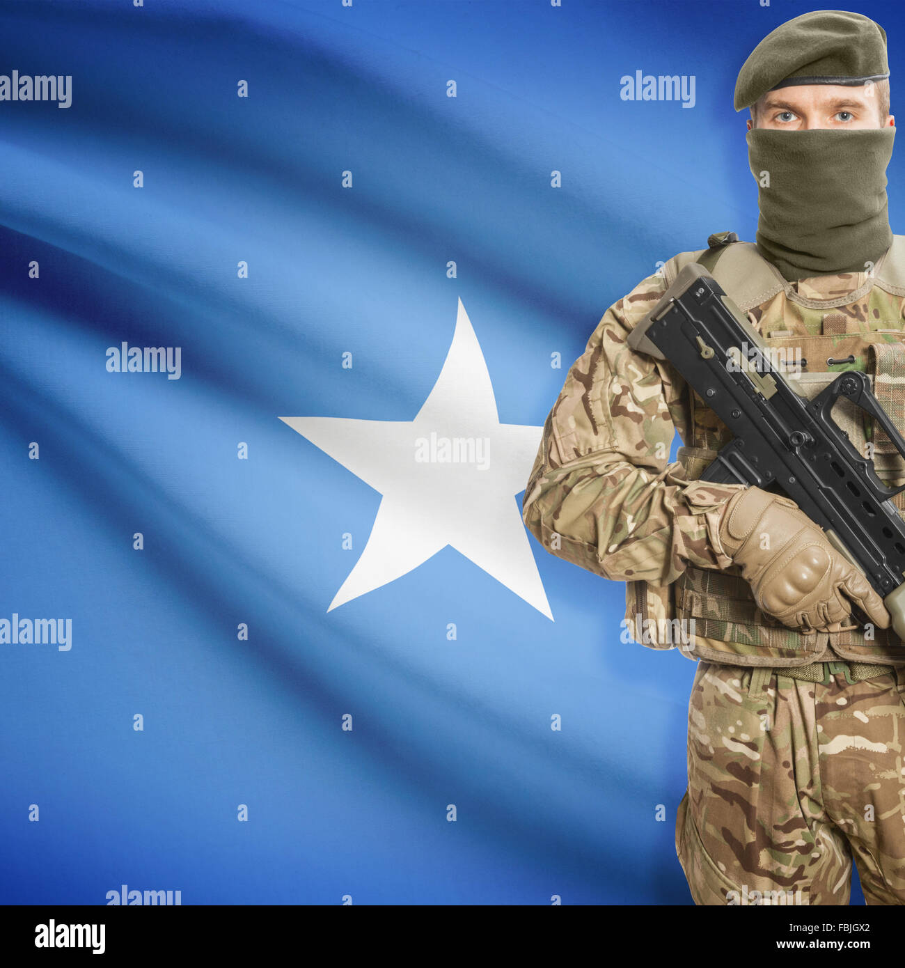 Soldier with machine gun and national flag on background series ...