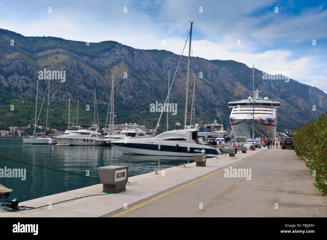 A cruise ship and small boats in Kotor harbour, Montenegro Stock Photo ...