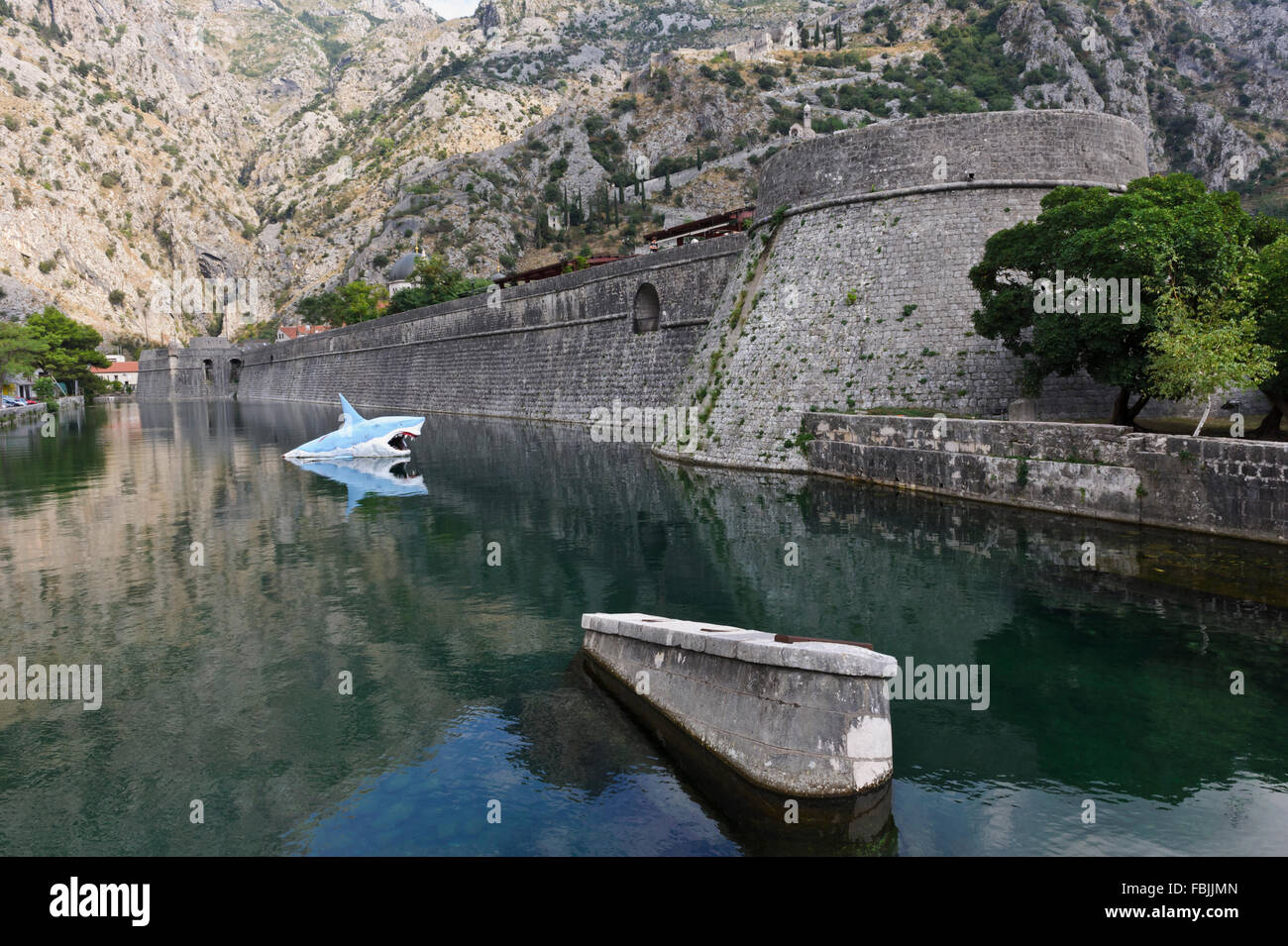 A shark sculpture outside the walls of the Old Fortress in Kotor ...