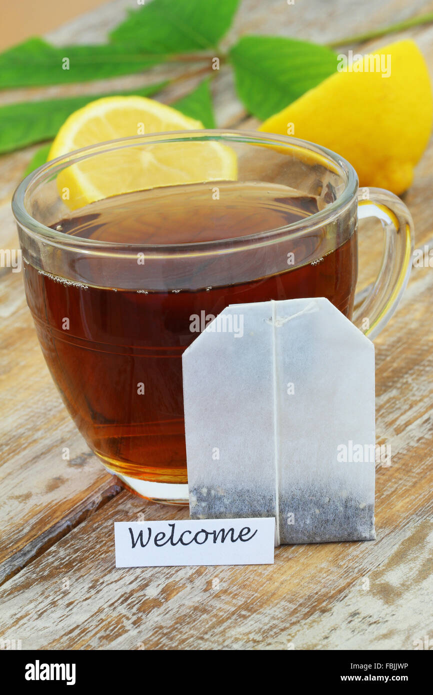 Welcome card with glass of tea and tea bag leaning against it Stock ...