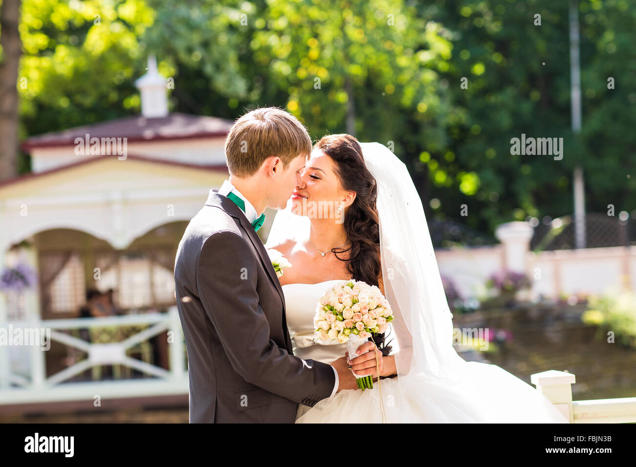 Bride and groom having a romantic moment on their wedding day Stock ...
