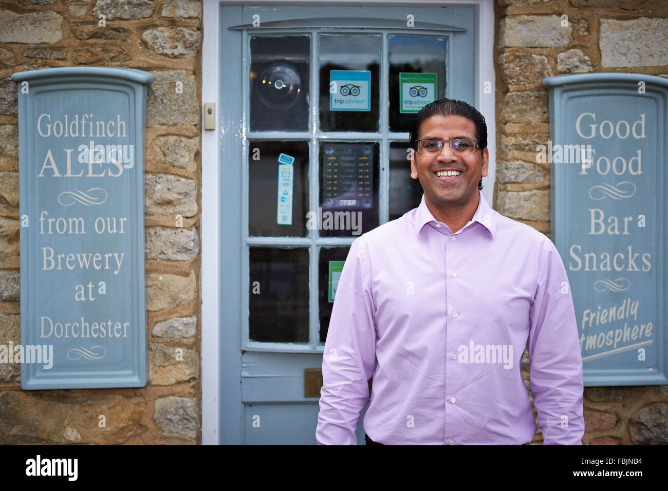 Landlord Anwar Pervaiz stands outside the entrance to the White Horse ...