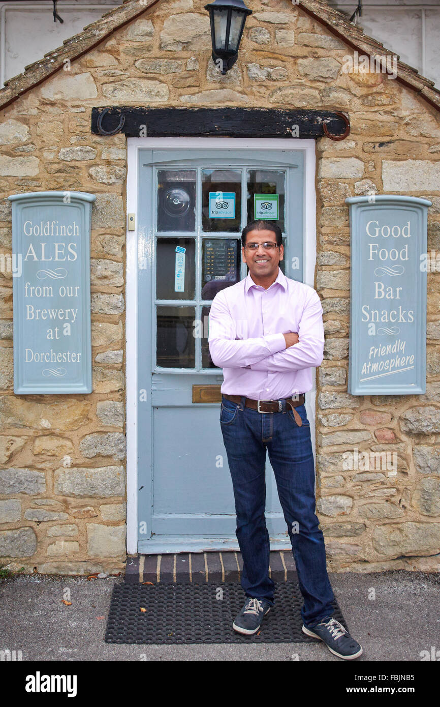 Landlord Anwar Pervaiz stands outside the entrance to the White Horse ...