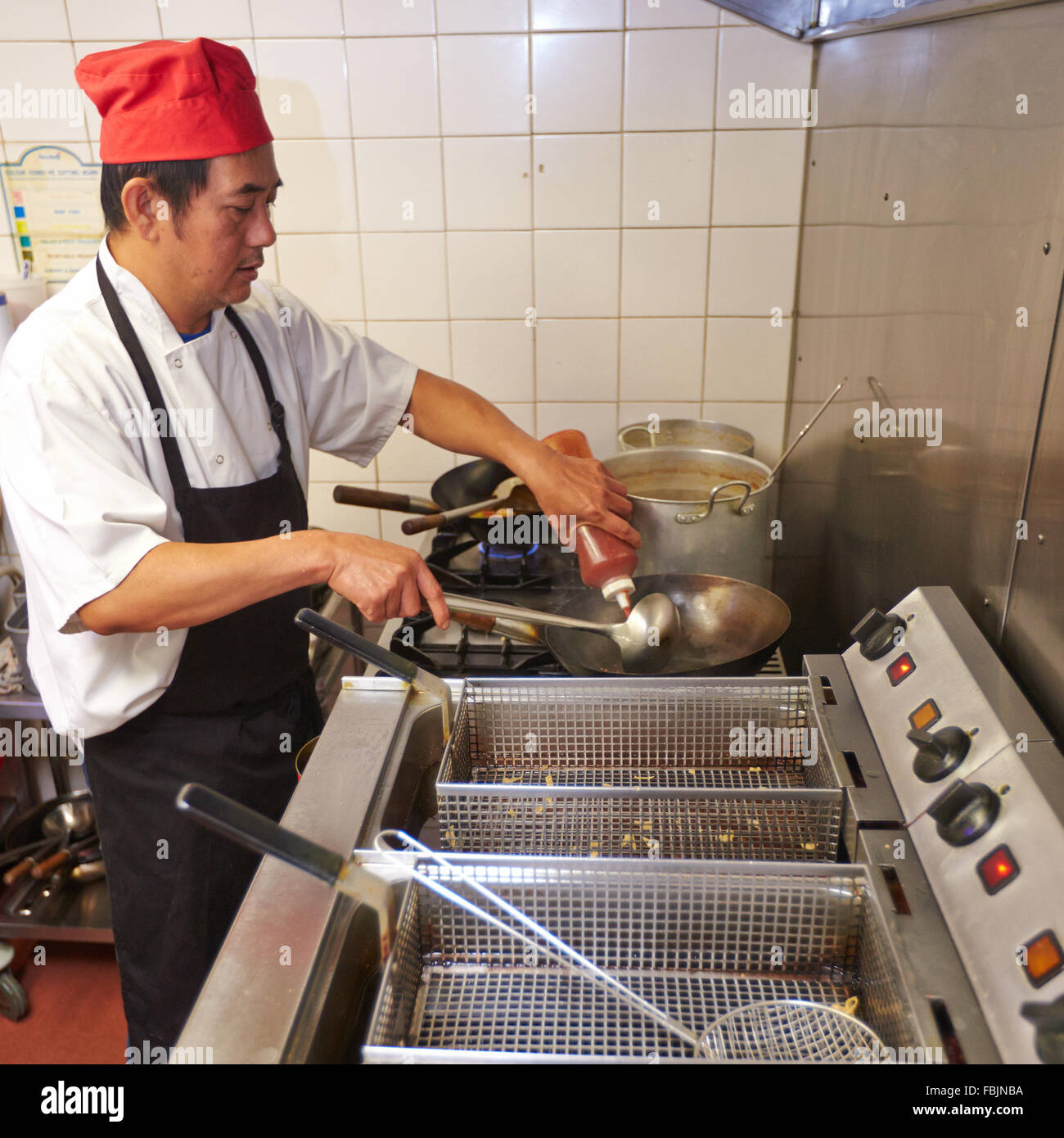 A chef cooking Thai food in a wok Stock Photo - Alamy