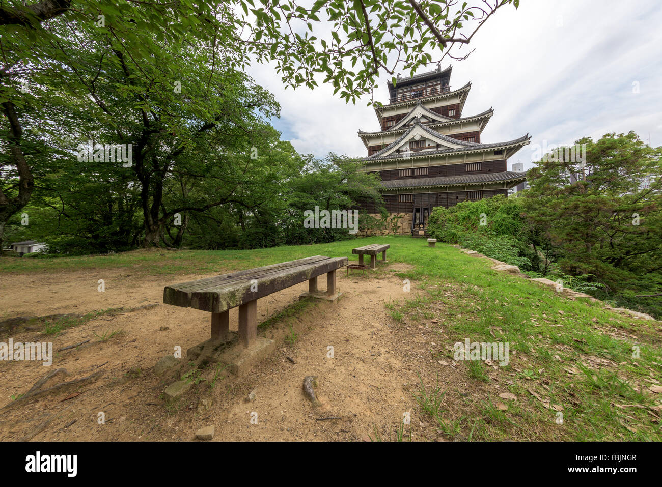 Japanese castle on the top of a hill with benches Stock Photo - Alamy