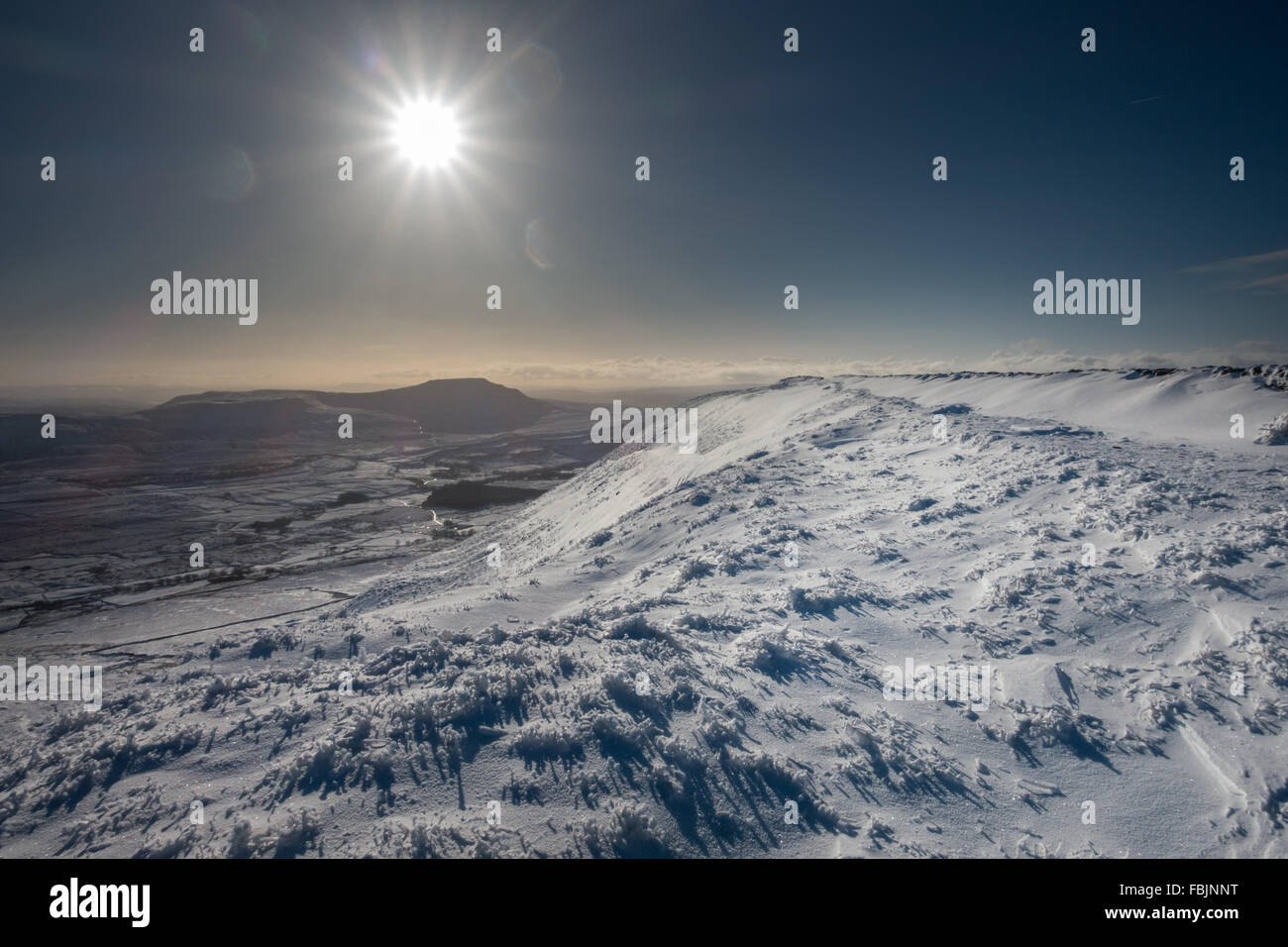 A sunny winter's day on the summit ridge of Whernside looking over to ...