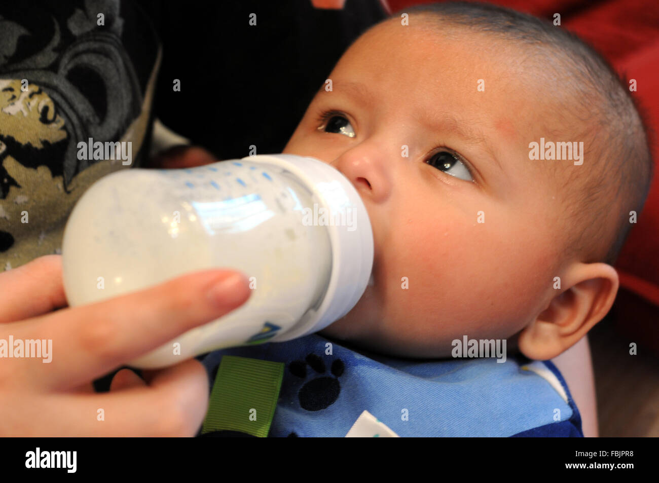 A baby feeding Stock Photo - Alamy