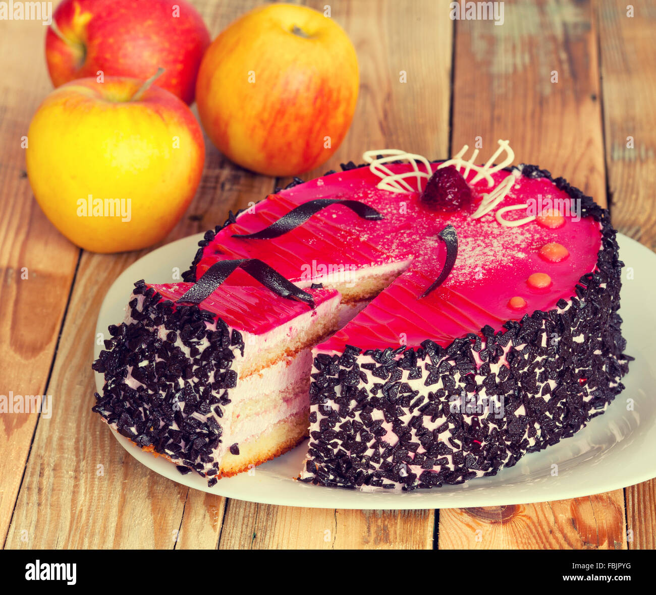 Fruit jelly sponge cake on wooden table Stock Photo - Alamy