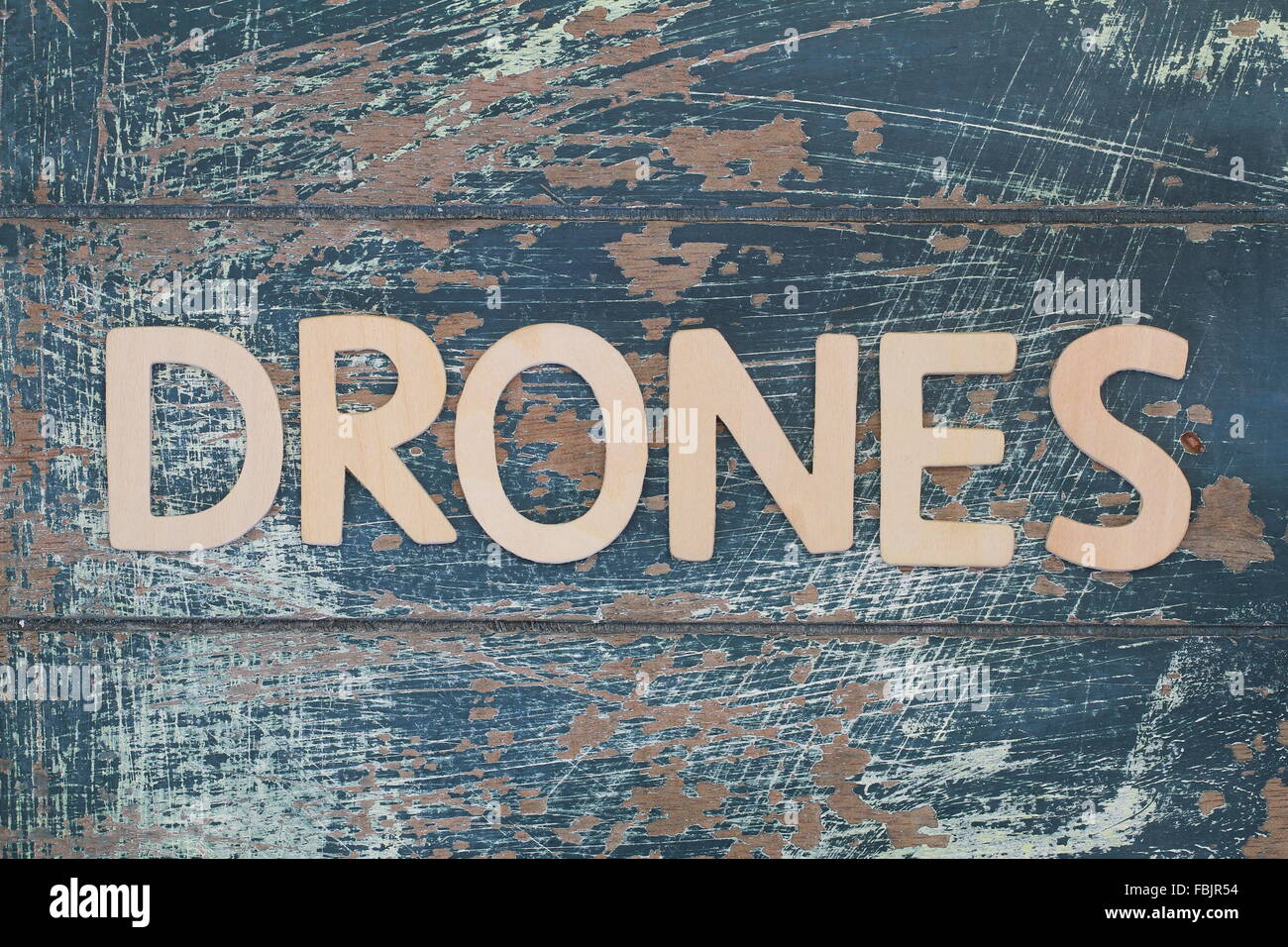 Word drones written with wooden letters on rustic surface Stock Photo ...