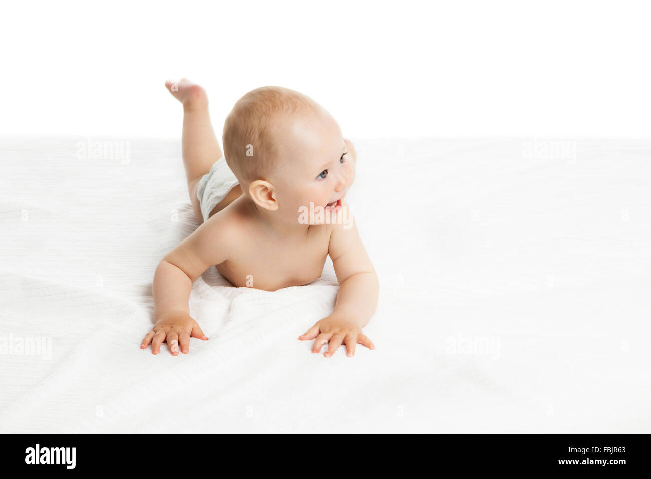 Adorable baby sitting over white background Stock Photo - Alamy