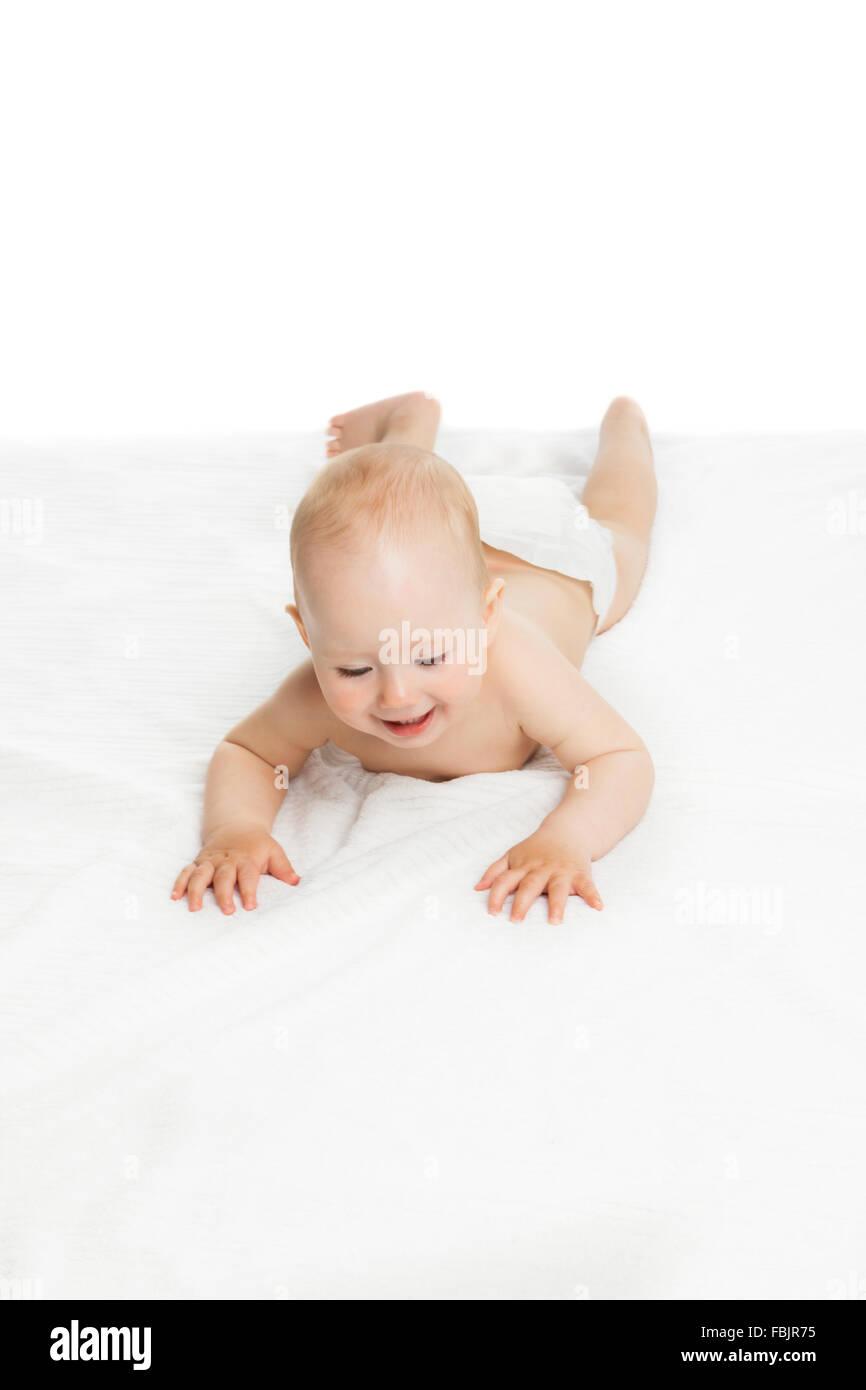 Adorable baby sitting over white background Stock Photo - Alamy
