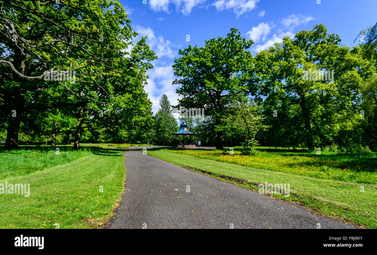 A path leads through Ormeau Park in South Belfast towards a bandstand ...