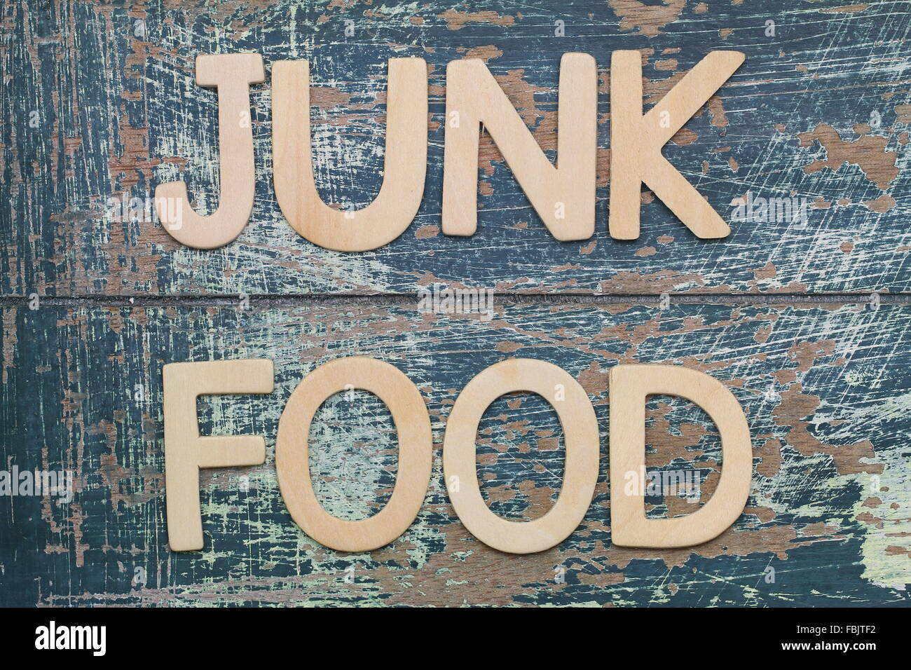 Junk food written with wooden letters on rustic surface Stock Photo - Alamy