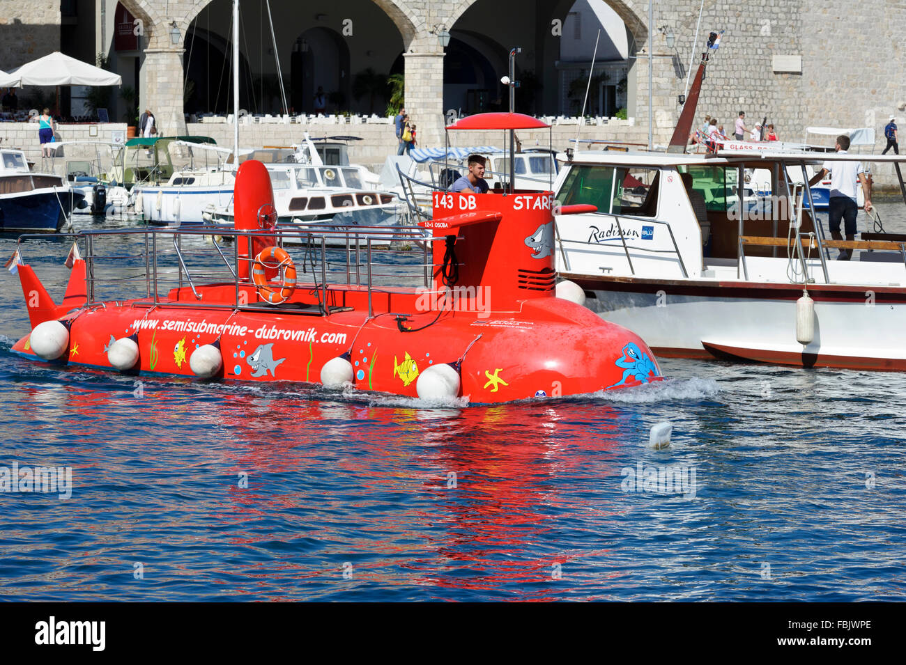 A red submarine leaving the Dubrovnik harbour, Croatia Stock Photo - Alamy