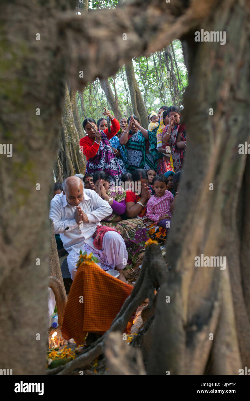 DHAKA, BANGLADESH 15th January 2016: Devotees with their Brahman's ...