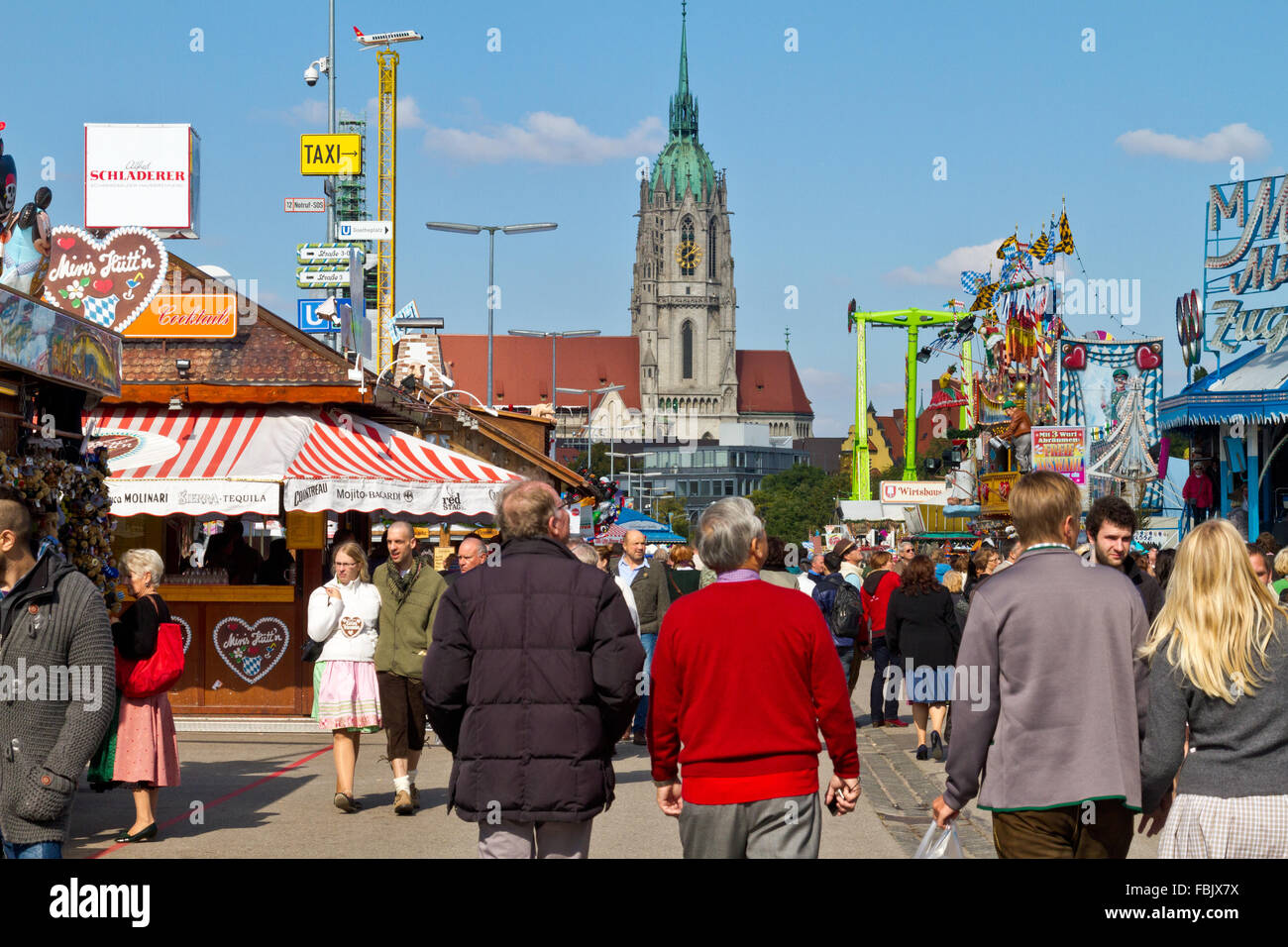 Crowd enjoying Oktoberfest in Munich, Germany with St. Paul's Cathedral ...