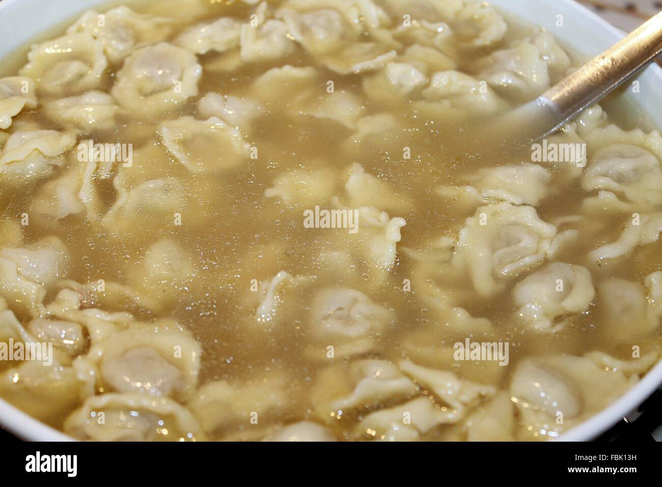 Italian pasta in broth called Capeletti, typical cuisine of Emilia ...